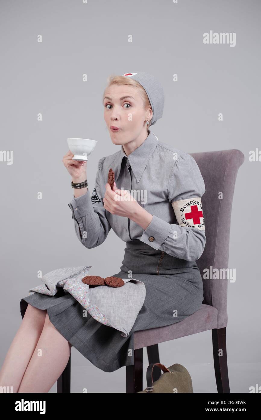 Woman actor reenactor in the historical uniform of the German army ...