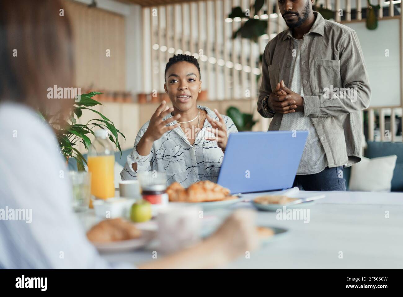 Business people talking over breakfast in office meeting Stock Photo ...