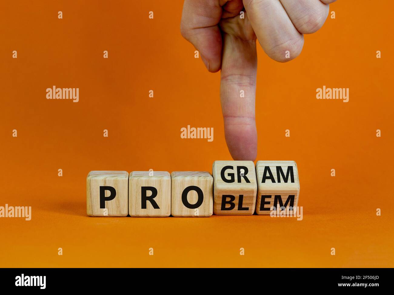 Solving a problem and making program symbol. Businessman turns wooden ...