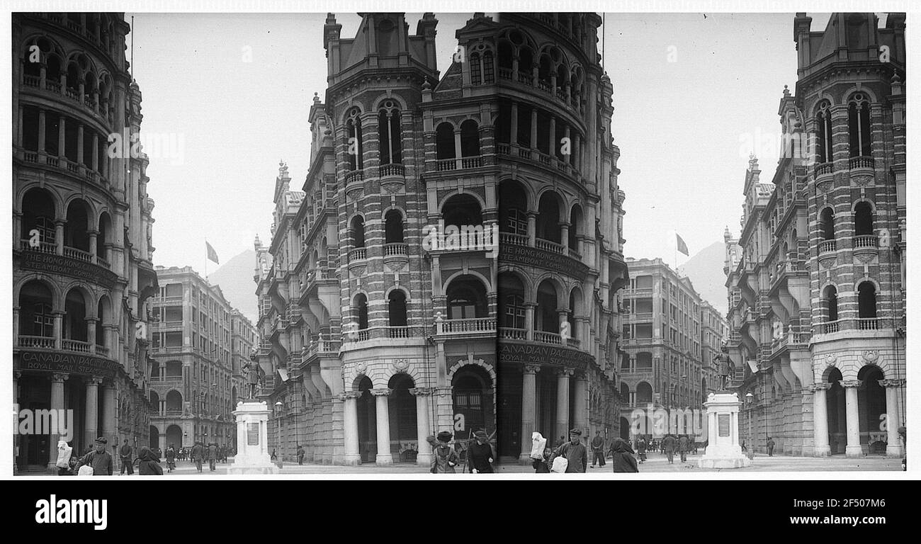 Hong Kong. Street with monument and commercial buildings with branches ...