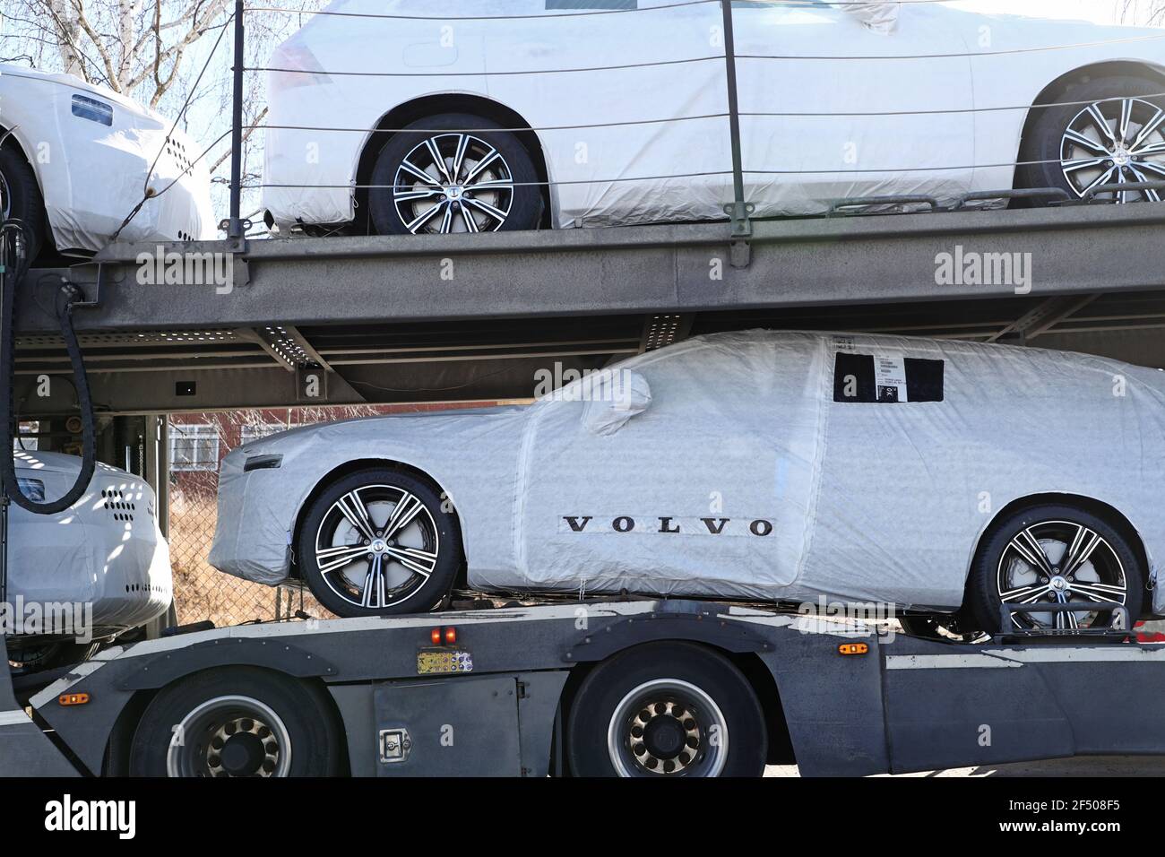 New Volvo cars on a car transport that arrived at a Volvo store for ...