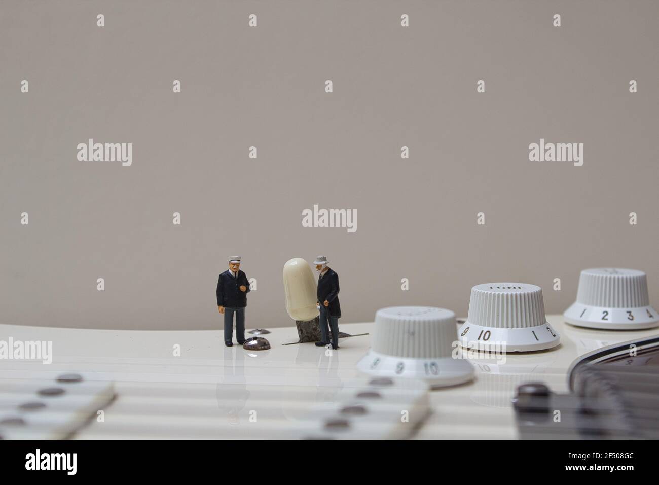 Closeup shot of small figures of people on an electric guitar Stock ...