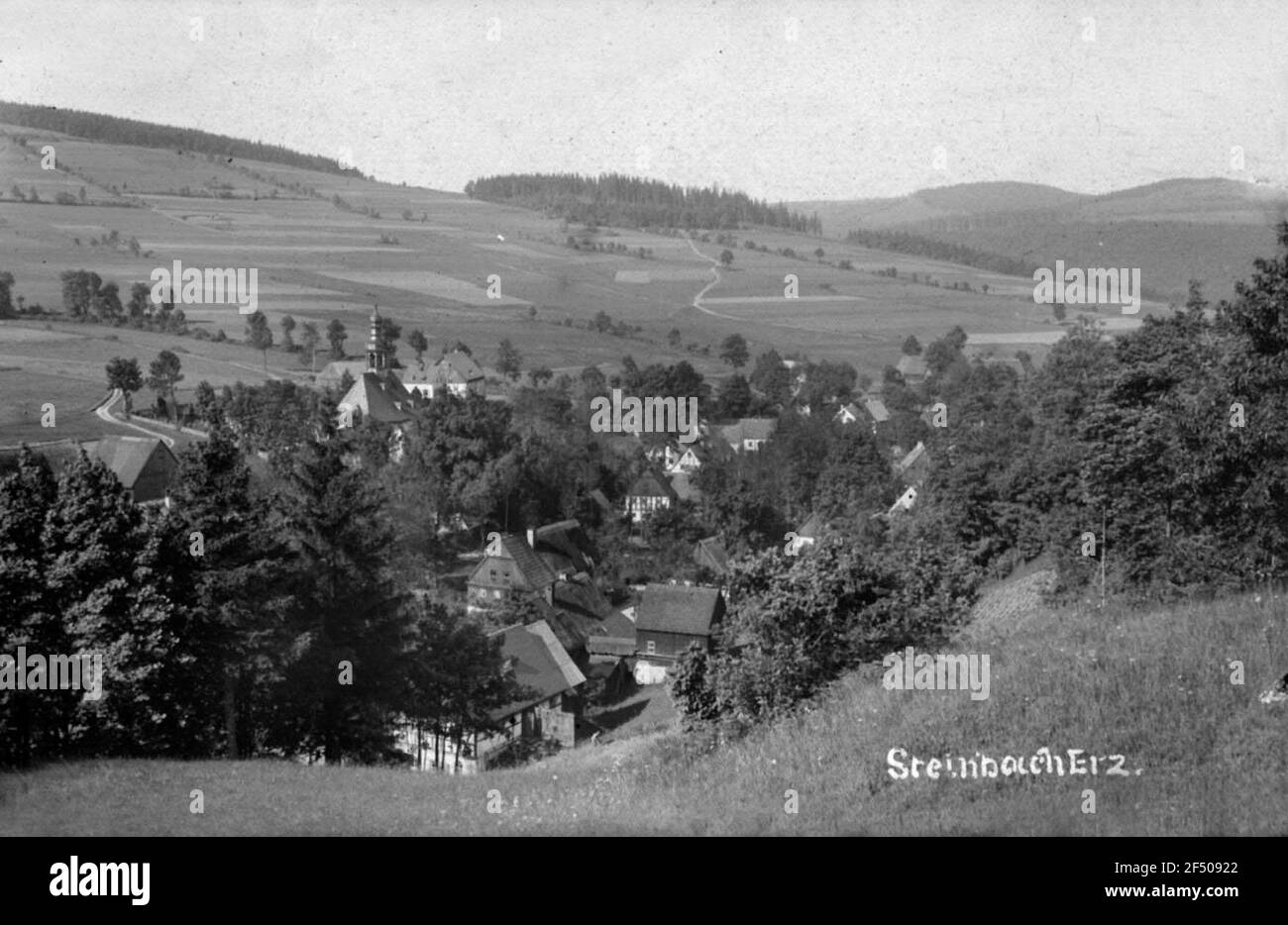 Middle village with church Stock Photo - Alamy