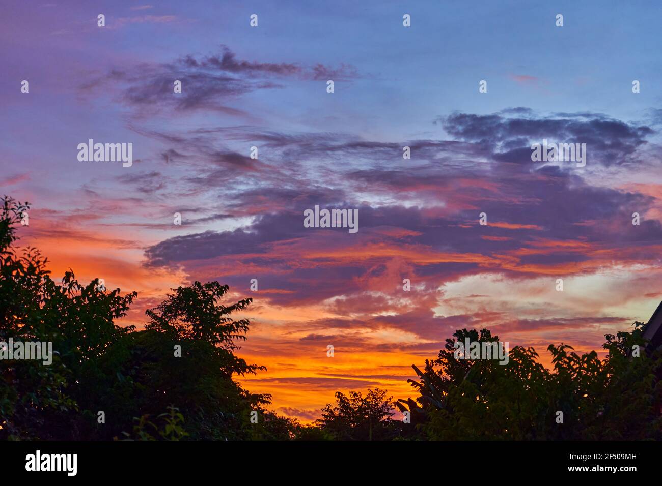Incredible red sunset clouds against the violet sky Stock Photo - Alamy