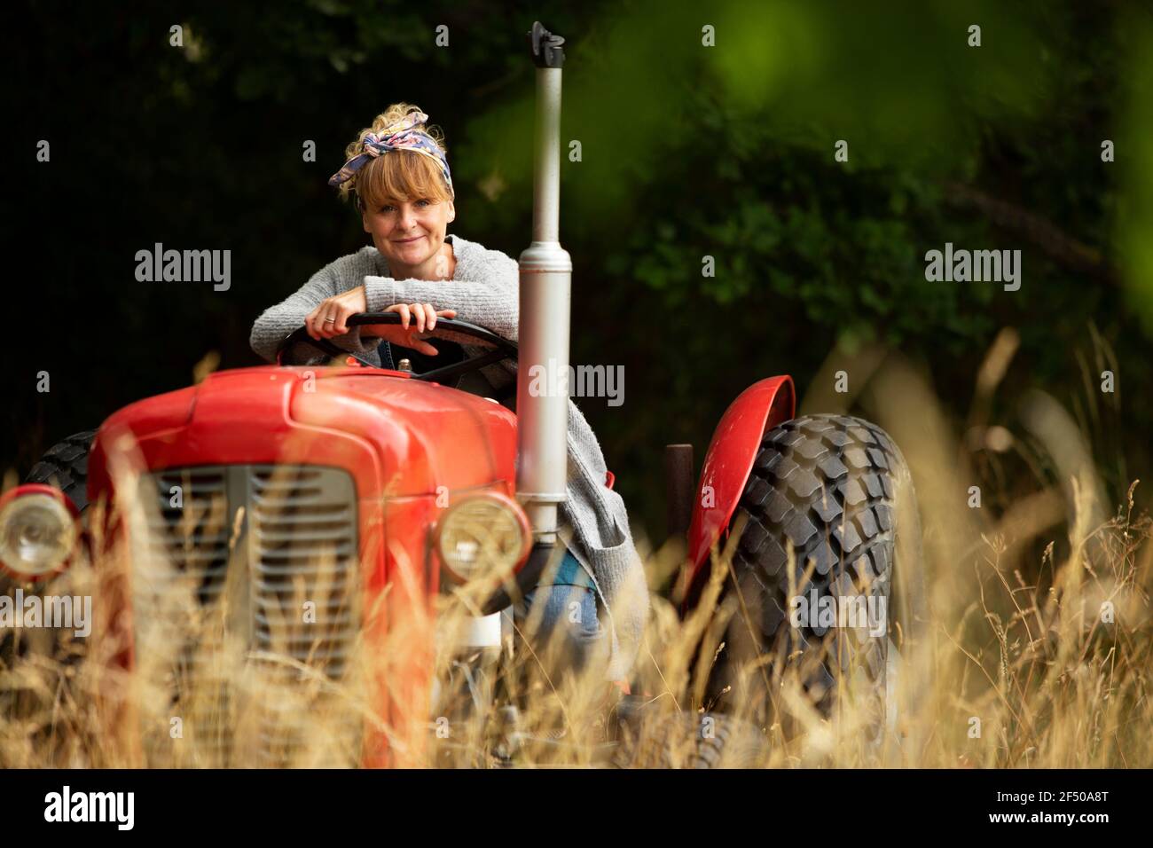 Woman driving tractor hi-res stock photography and images - Alamy