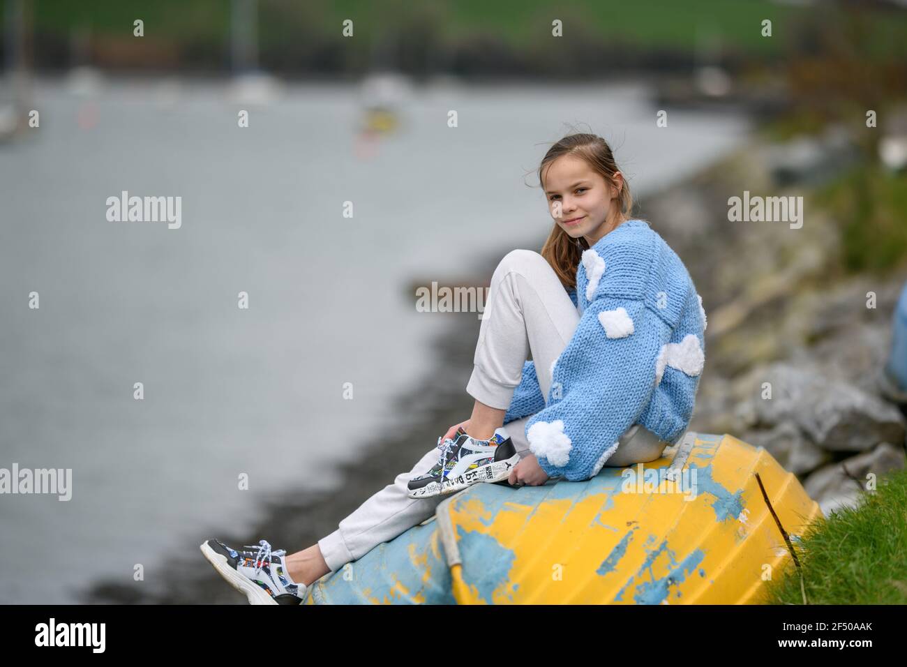 Sitting on a Yellow Boat Stock Photo - Alamy