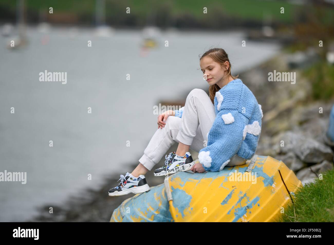 Sitting on a Yellow Boat Stock Photo - Alamy