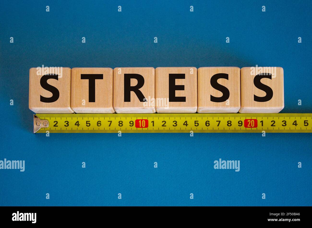 Stop stress and be health symbol. Wooden cubes with the word 'stress ...