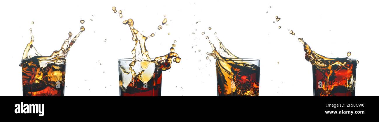 Whiskey splash of isolated on white background Stock Photo - Alamy
