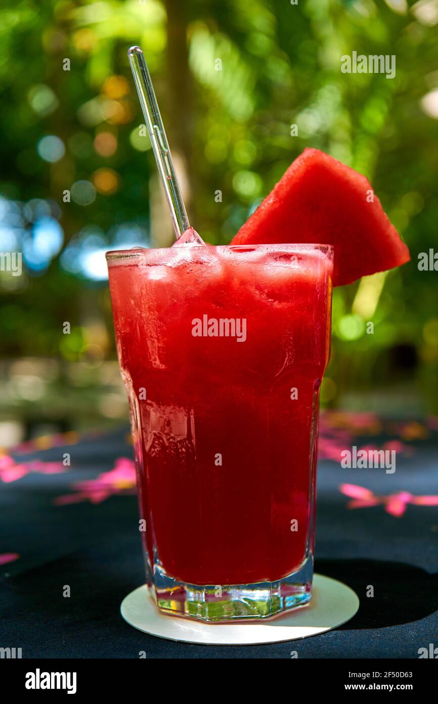 Glass cup of freshly squeezed watermelon juice with ice Stock Photo - Alamy