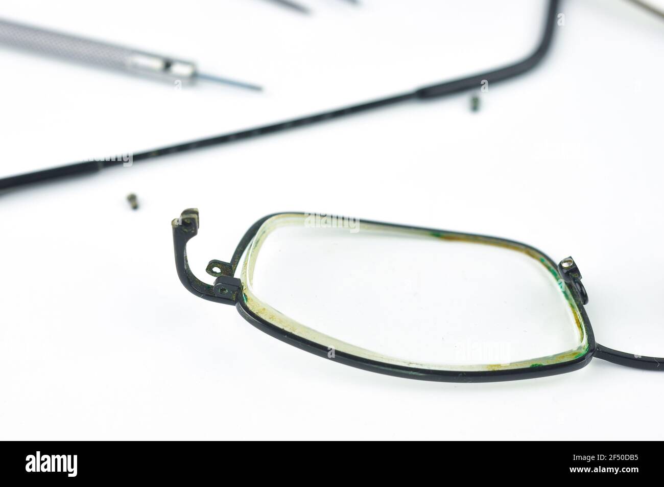 Broken Eyeglasses on grey background. Eyeglasses repair concept Stock ...