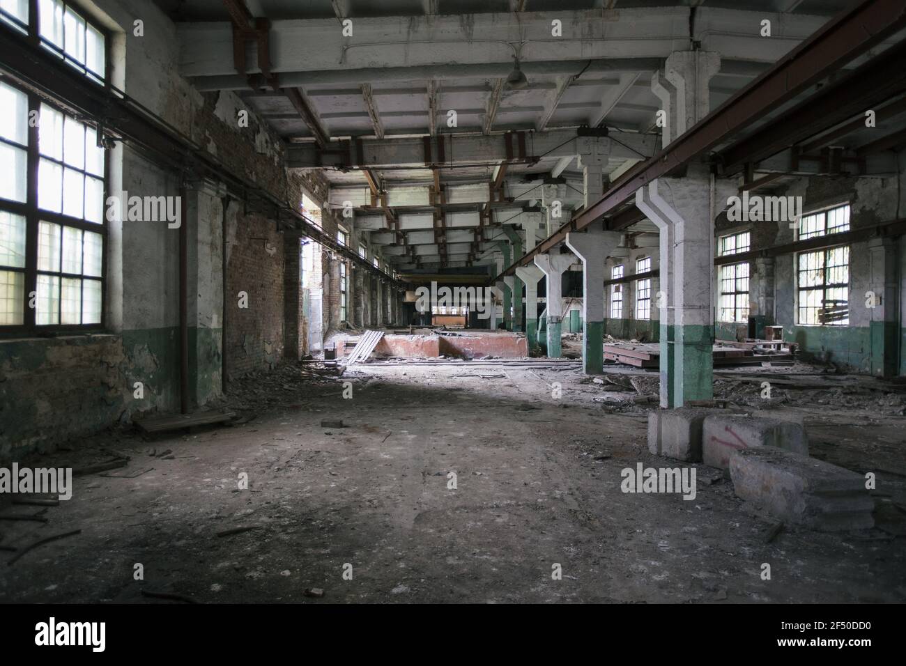 Abandoned factory. Large empty industrial hall with garbage Stock Photo ...