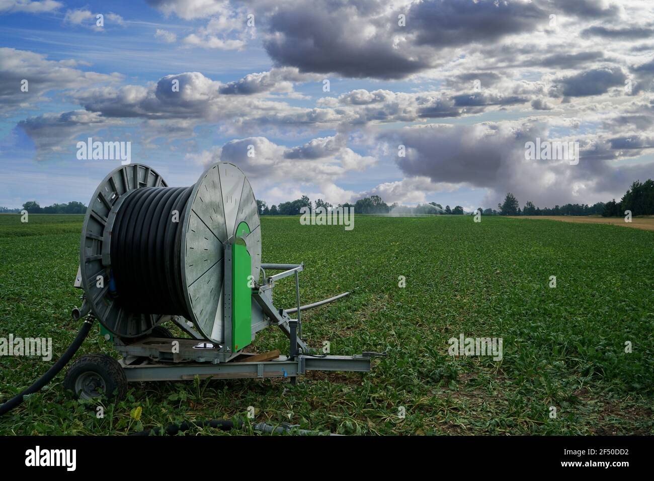 Large roll of hose on an industrial field Stock Photo - Alamy