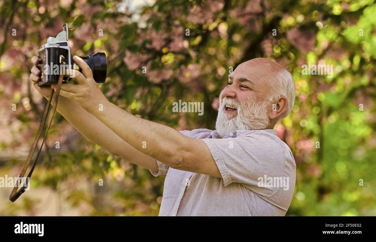 Memories in snap. Everyone photogenic. Senior man taking selfie photo ...