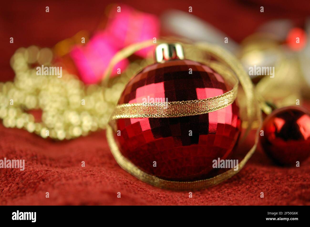 Christmas tree ball and golden ribbon on the background of Christmas ...