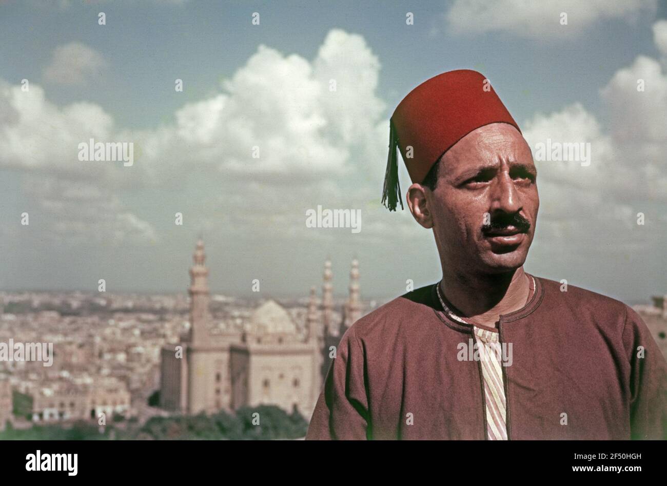 Cairo, portrait of an Egyptian in front of the Sultan Hassan Mosque ...