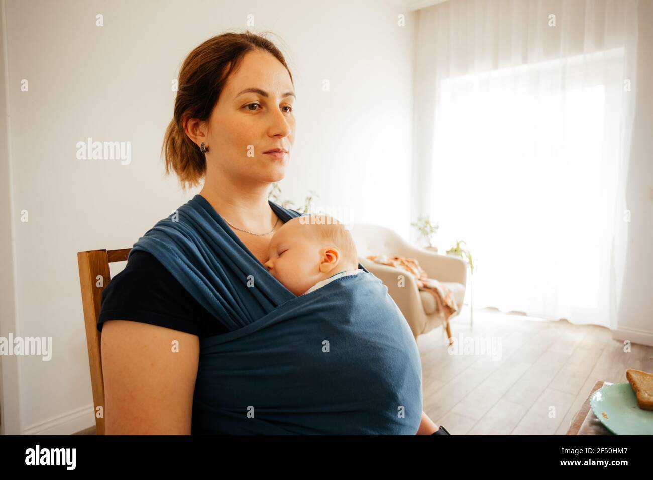 Mother feeling tired after hours of comforting her baby Stock Photo - Alamy