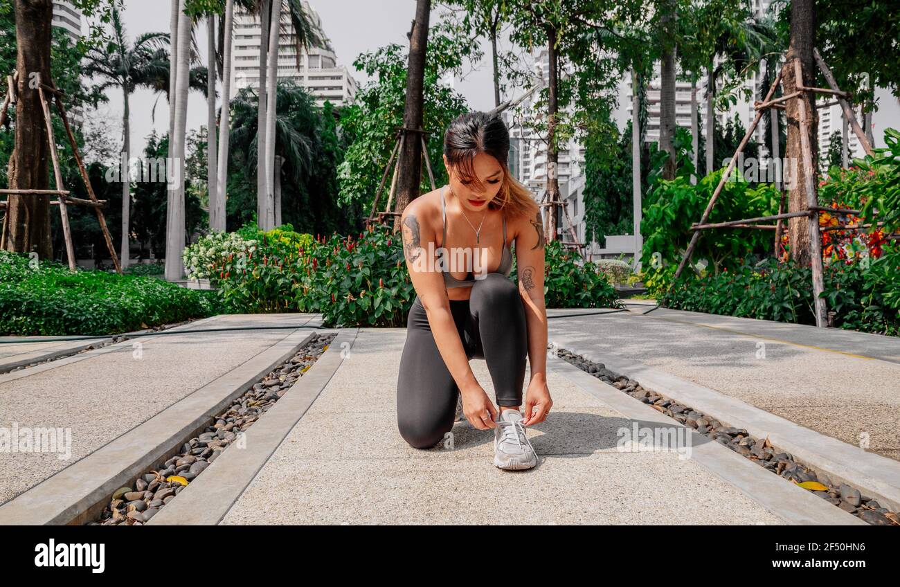 Asian sport girl doing stretching, yoga fitness and plank exercise ...