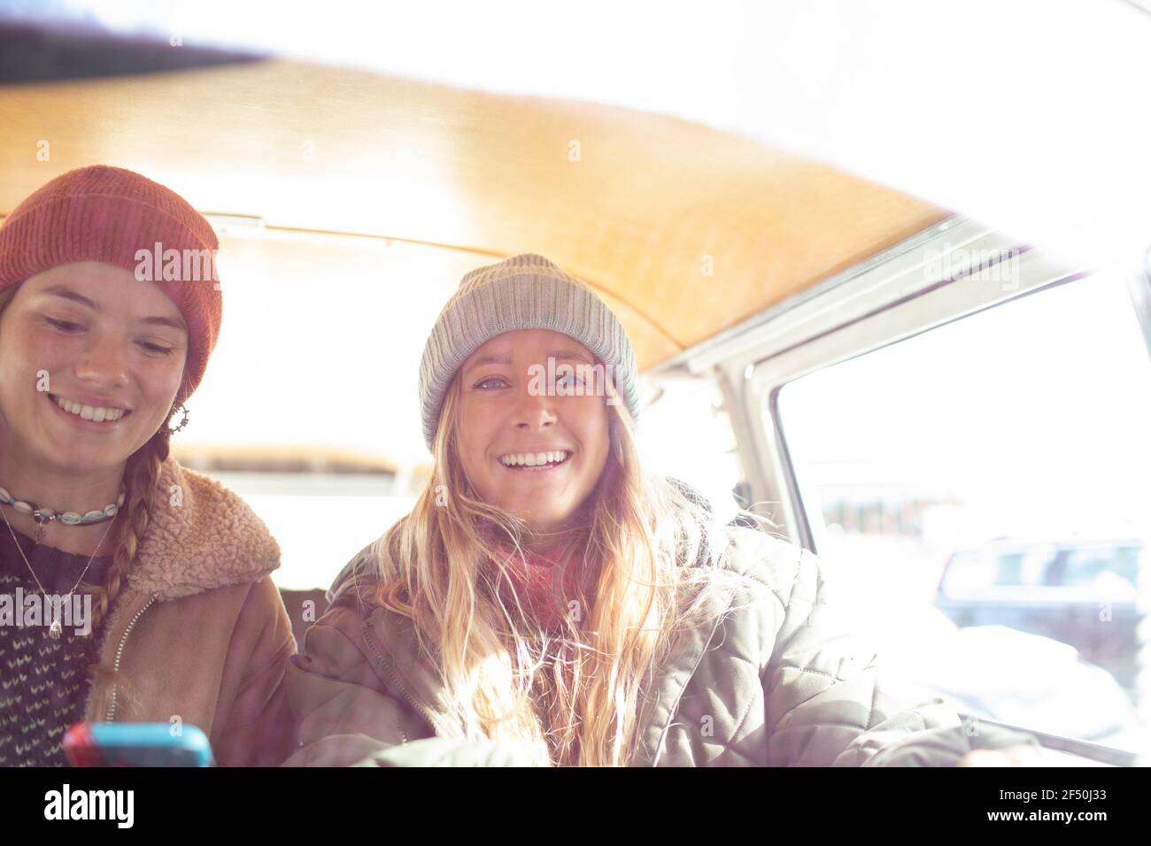 Two young women driving white hi-res stock photography and images - Alamy
