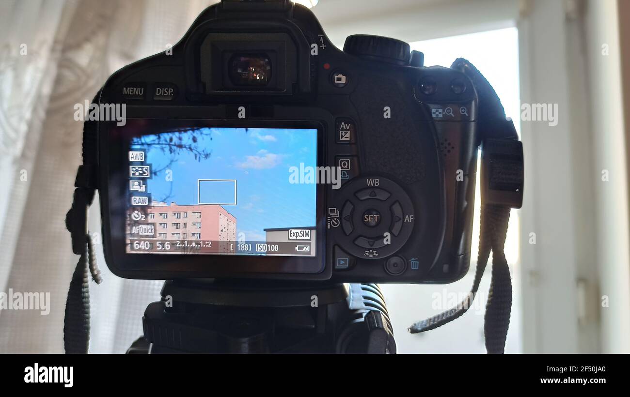 LCD display of a DSLR digital camera taking picture of a clouds fixed ...