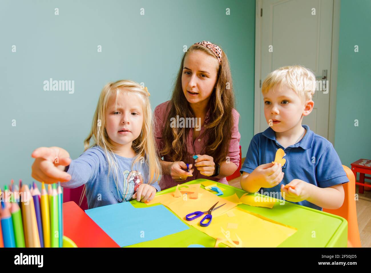 children and tutor study together at the creative school Stock Photo ...