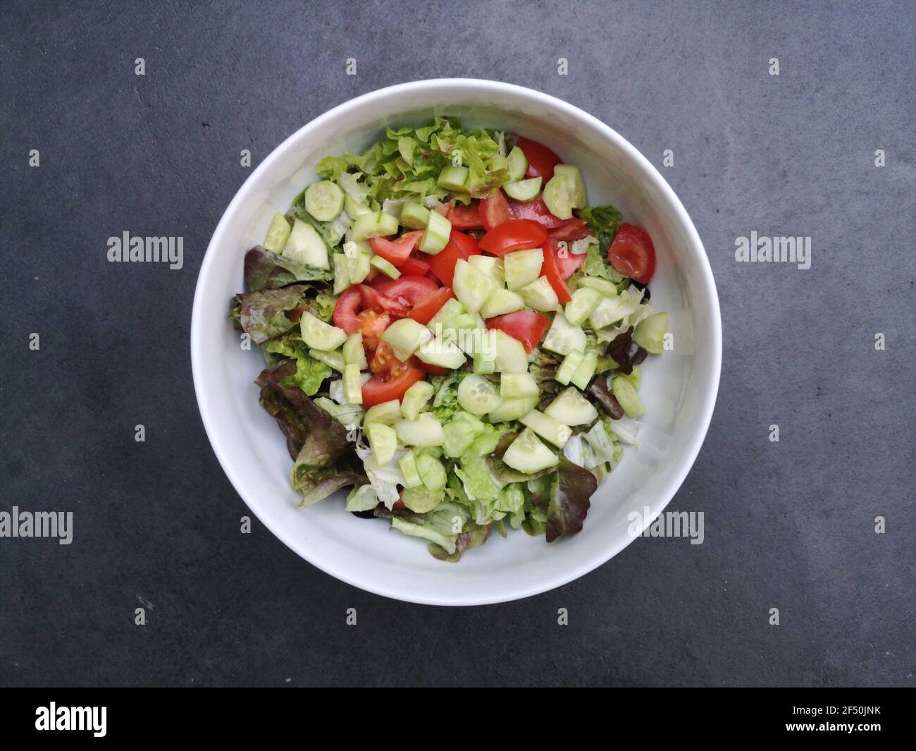 Top view shot of a white ceramic bowl filled with a salad Stock Photo ...