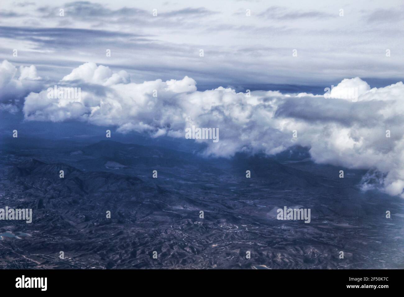 Clouds and landscape background from an airplane Stock Photo - Alamy