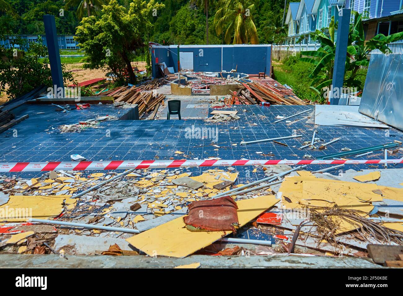 Demolition of a house destroyed by a hurricane. Construction garbage ...
