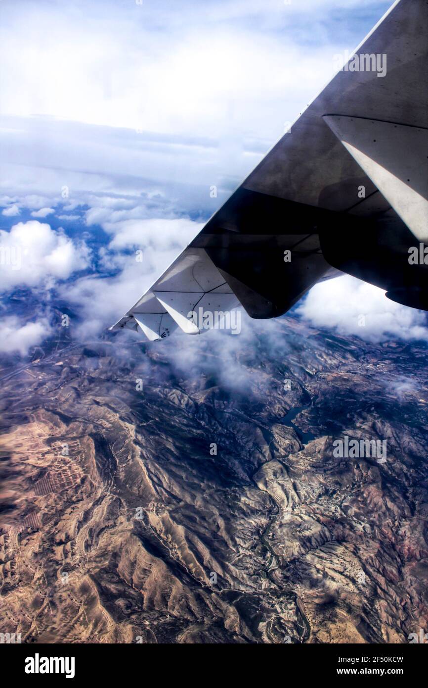 Clouds and landscape background from an airplane Stock Photo - Alamy