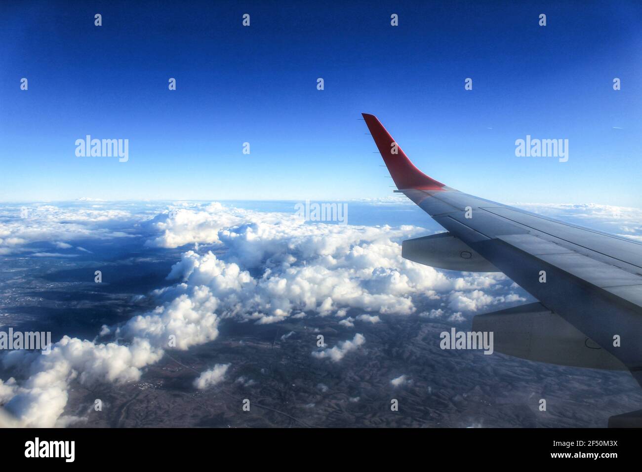 Clouds and landscape background from an airplane Stock Photo - Alamy