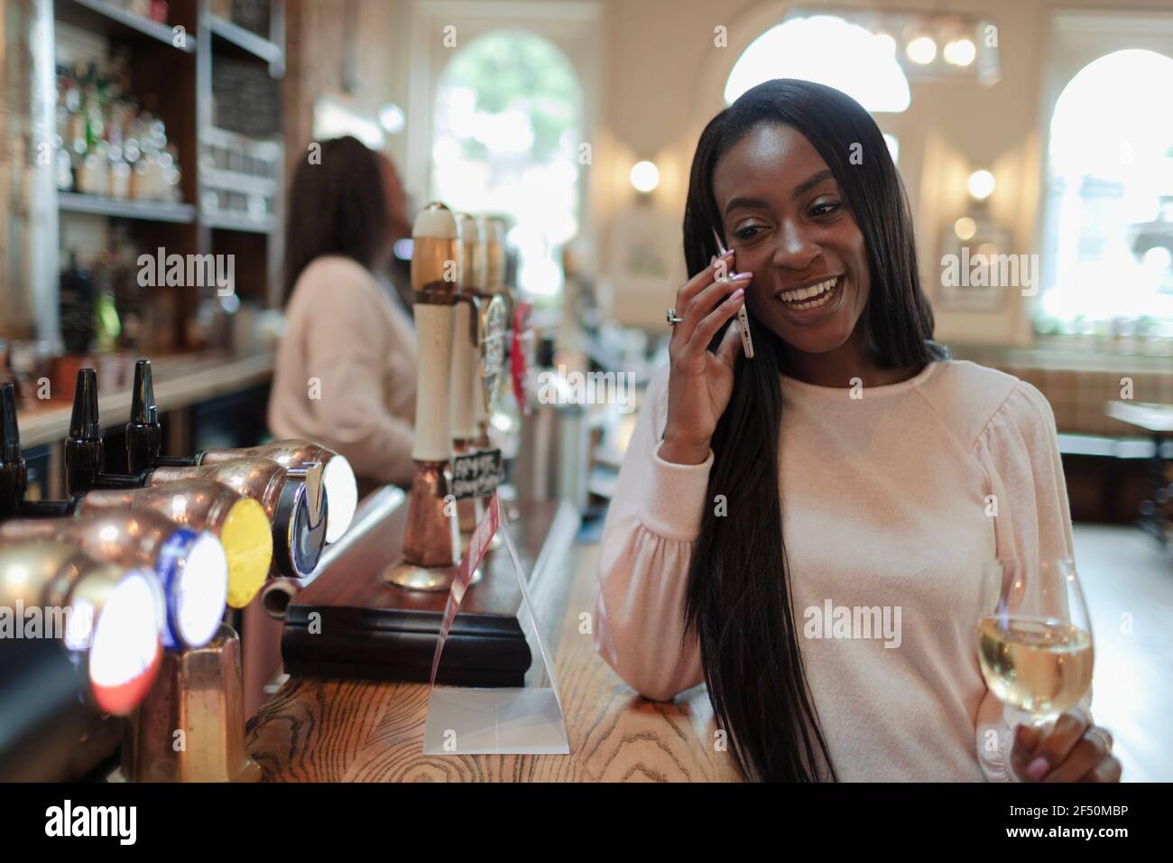 Woman standing straight in pub hi-res stock photography and images - Alamy