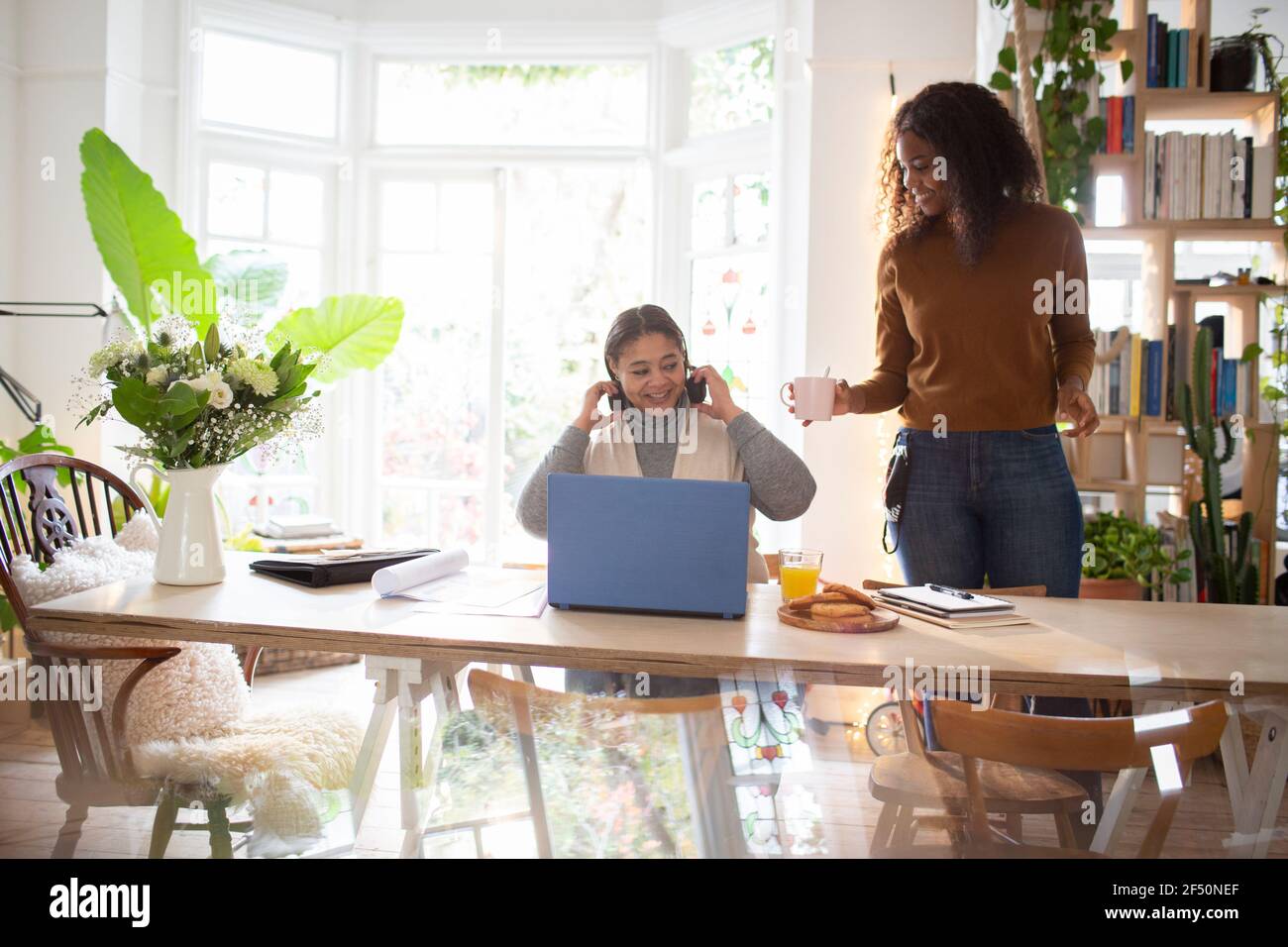 Working at a coffee table hi-res stock photography and images - Alamy