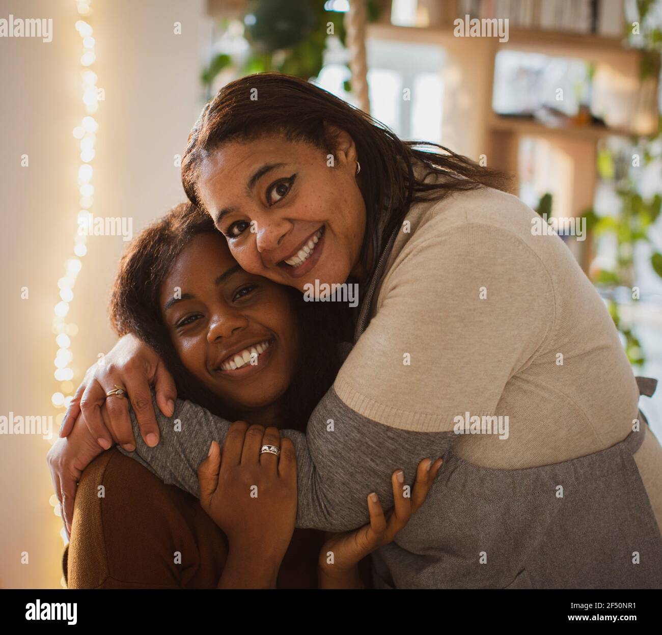 Portrait happy hugging daughter hi-res stock photography and images - Alamy