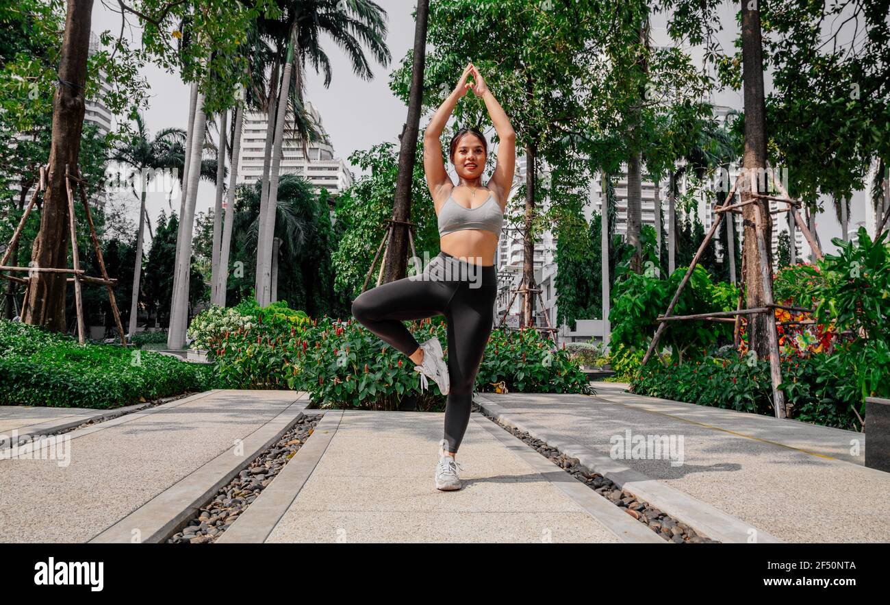 Asian sport girl doing stretching, yoga fitness and plank exercise ...