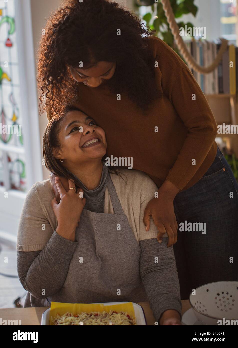 Happy young mother preparing hi-res stock photography and images - Alamy