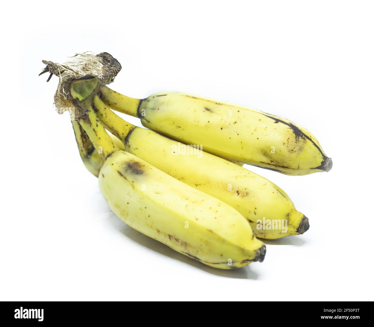 Closeup of very ripe bananas isolated on white background Stock Photo ...