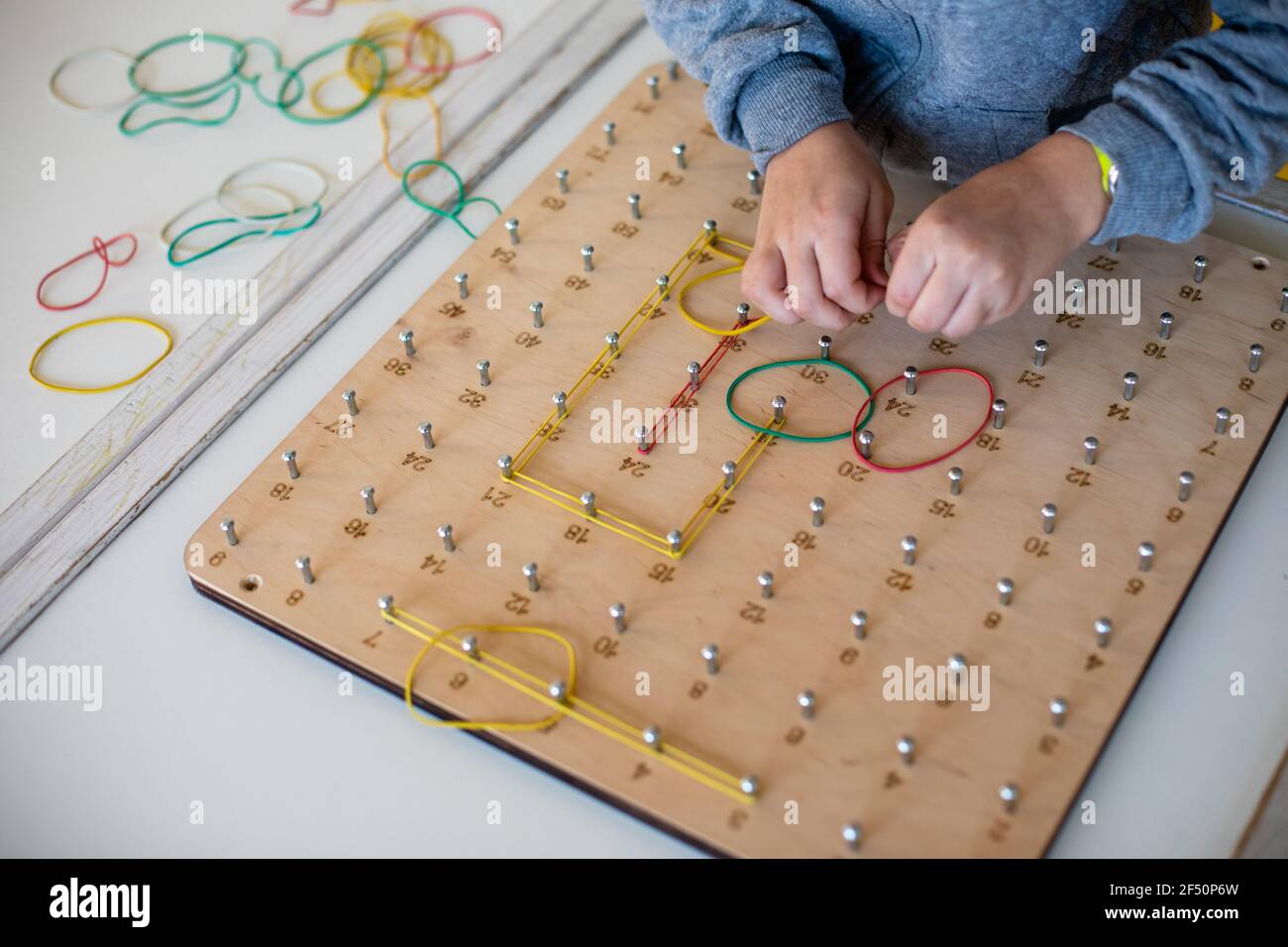 Exploring basic math and geometry concepts with geoboard Stock Photo ...