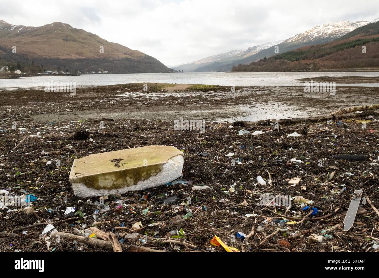 Marine litter including plastic and polystyrene washed up on the shores ...