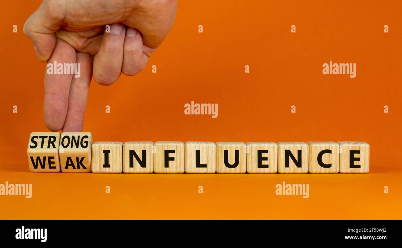 Weak or strong influence symbol. Businessman turns cubes and changes ...
