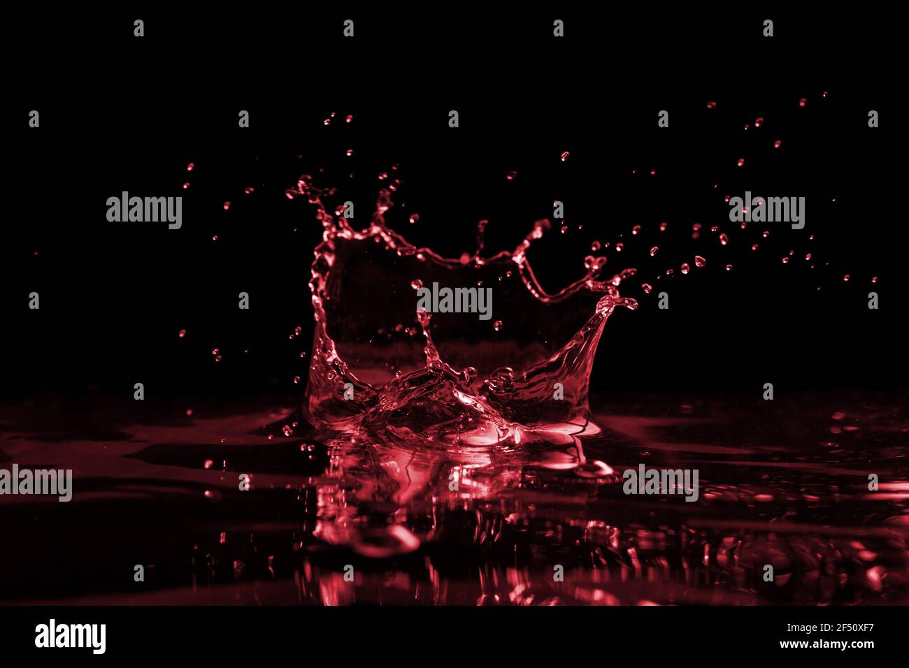 Red splash on black hi-res stock photography and images - Alamy