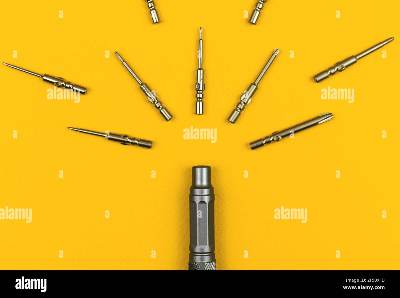 Mechanical bit set tool concept on a yellow background photo Stock ...