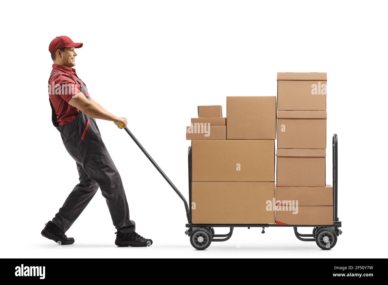 Worker pulling a hand truck loaded with cardboard boxes isolated on ...
