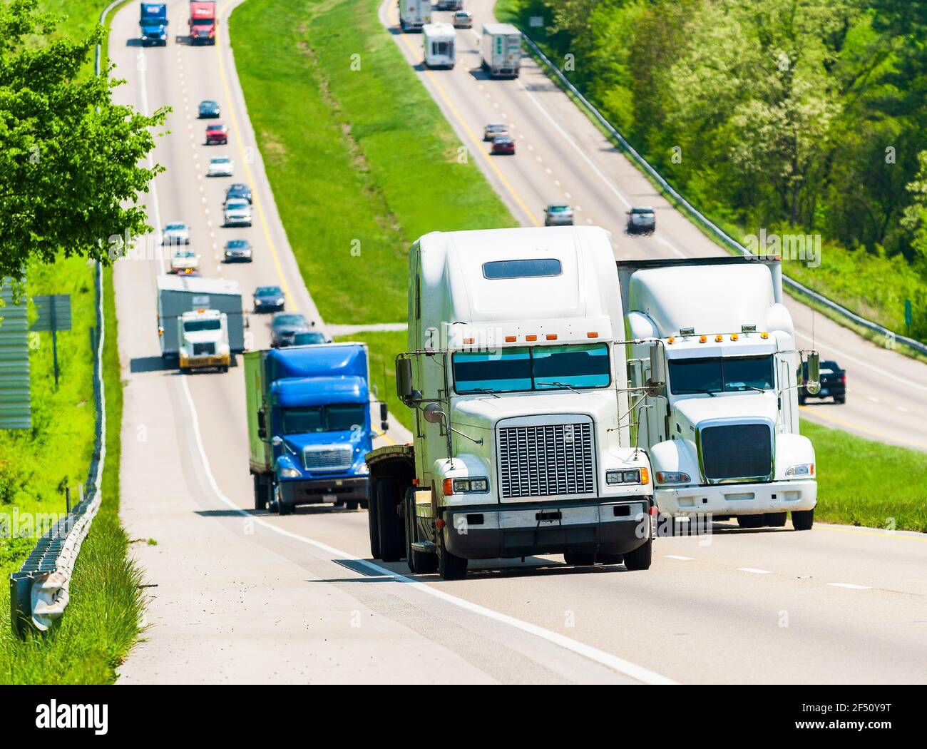 Horizontal shot of a tractor trailer rig leading traffic up a Tennessee ...