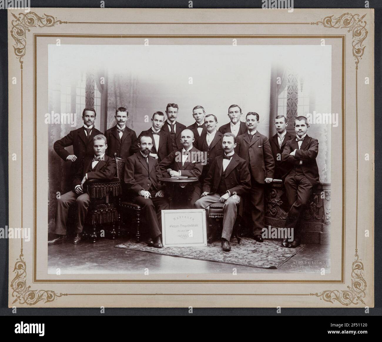 Apprentice group of 1900 in front of room decoration graduation ...
