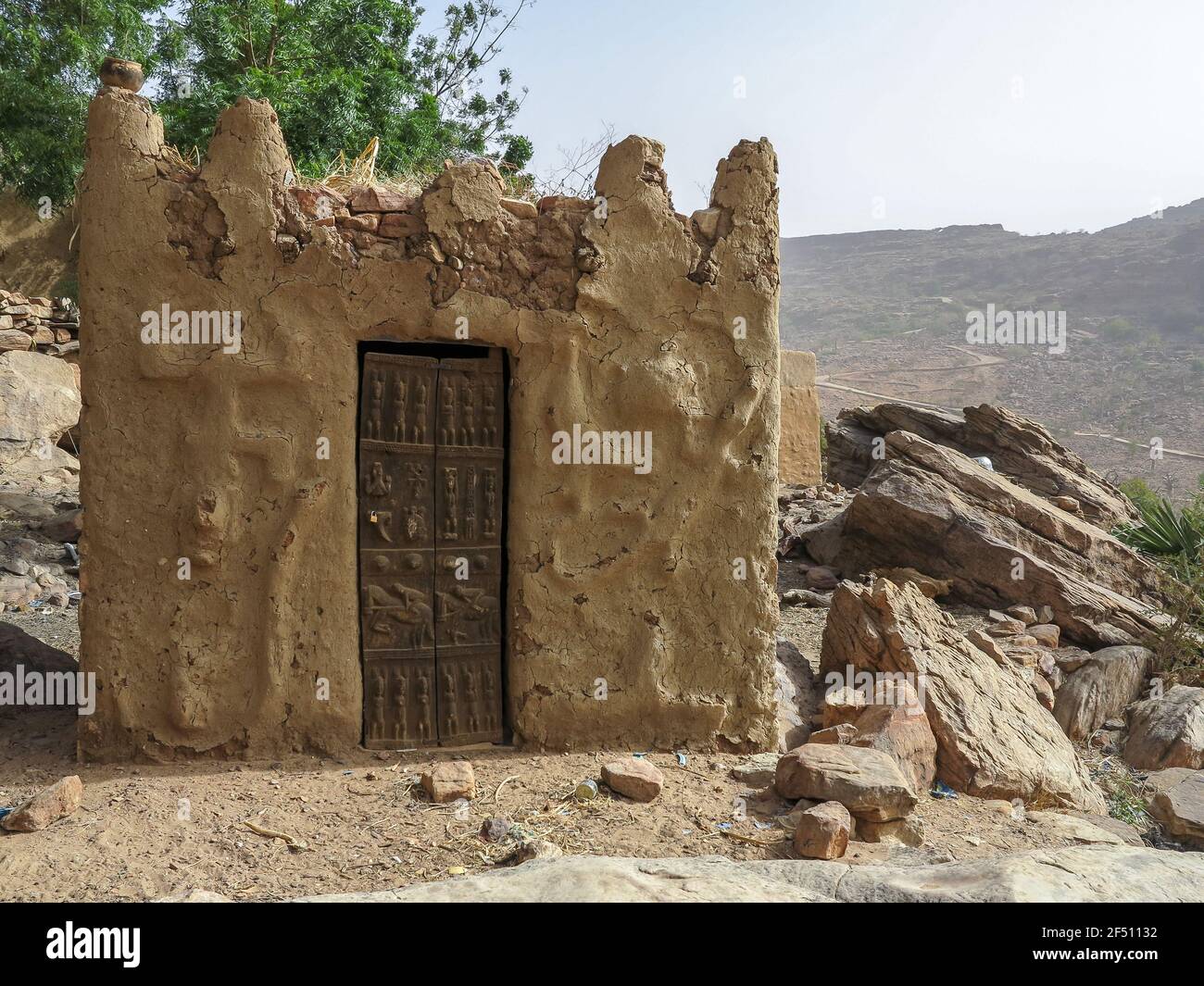 A traditional Dogon house with a finely carved door at Sangha, an ...