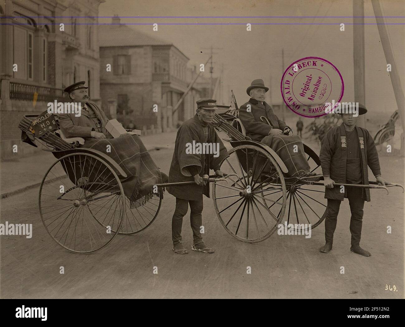 Japan. Two tourists in riding russians with native drivers Stock Photo ...