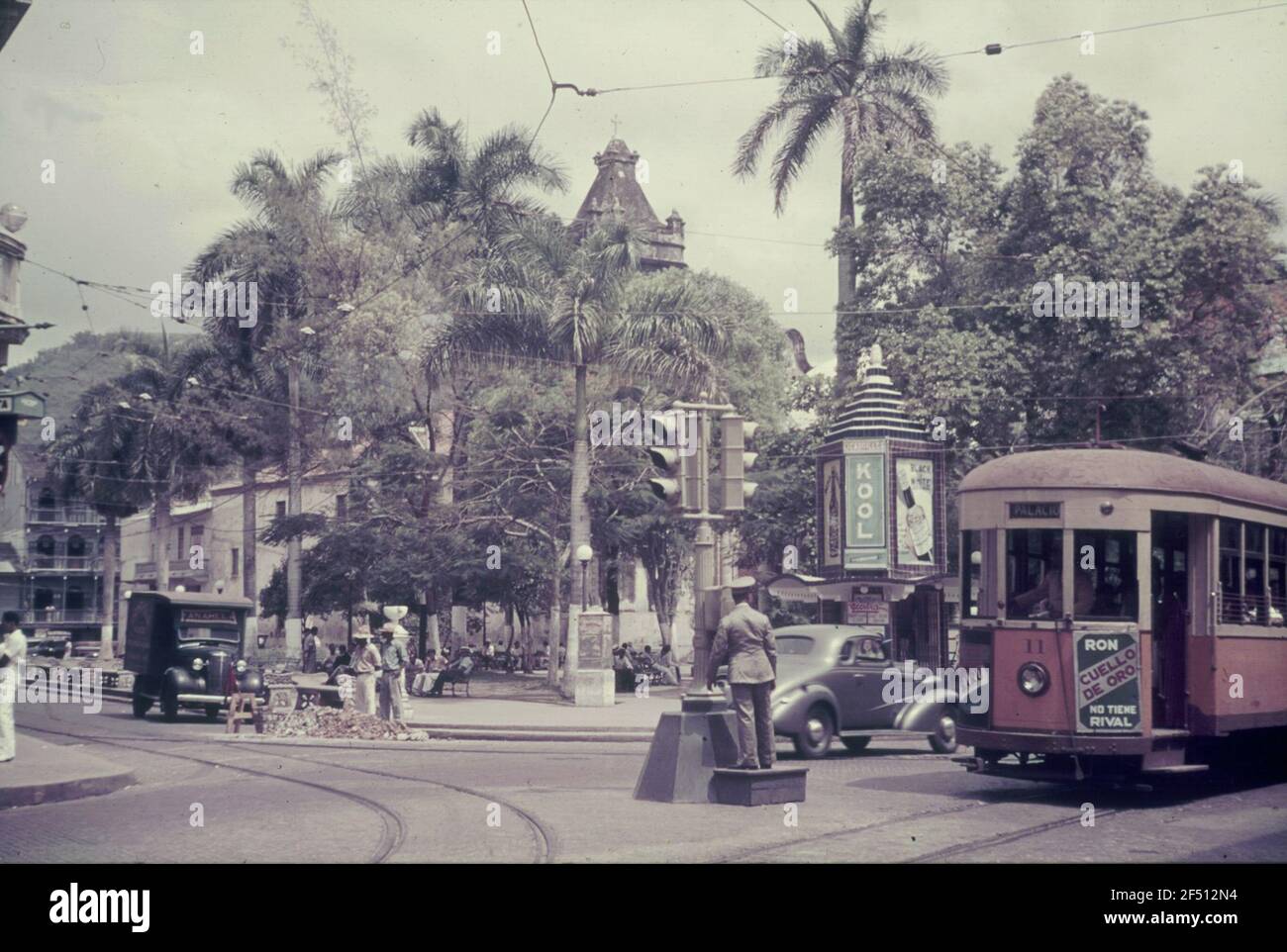 Travel photos. Road crossing with traffic policers and tram towards ...