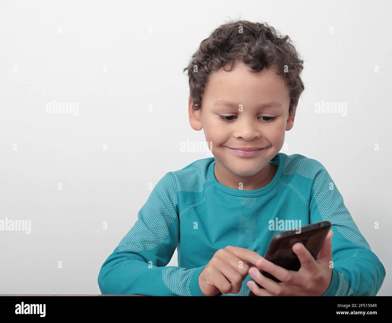 little boy with mobile making a phone call stock photo Stock Photo - Alamy