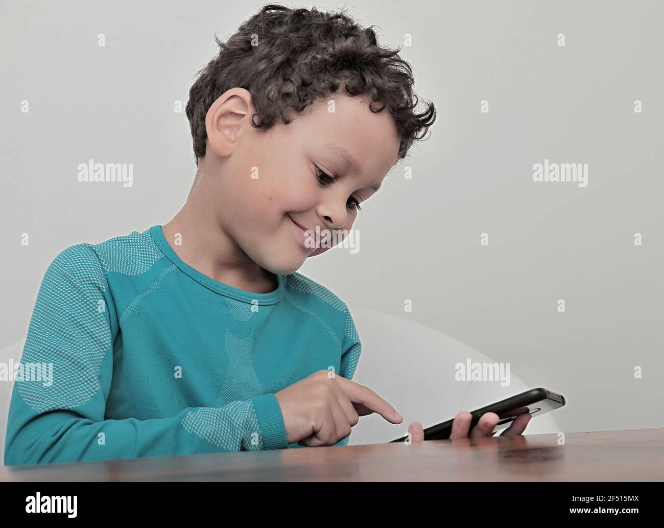little boy with mobile making a phone call stock photo Stock Photo - Alamy