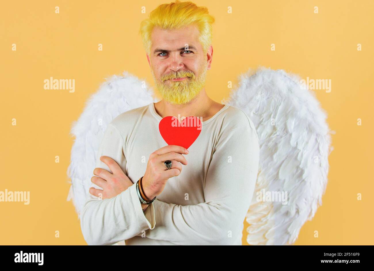 Happy Valentine Day. Male angel with red heart. Bearded man with white ...